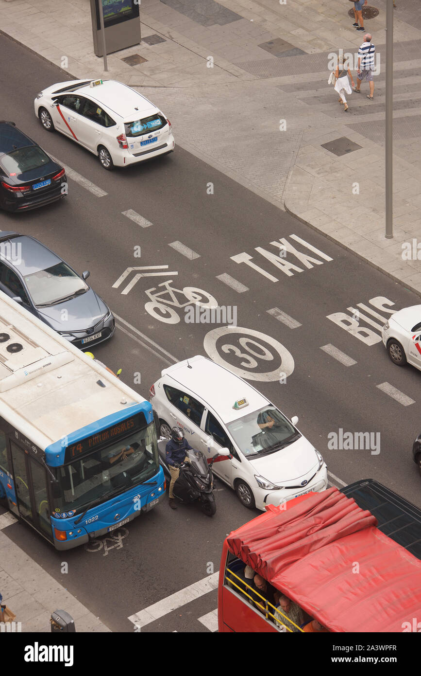 Traffic on a busy street showing road markings Stock Photo - Alamy