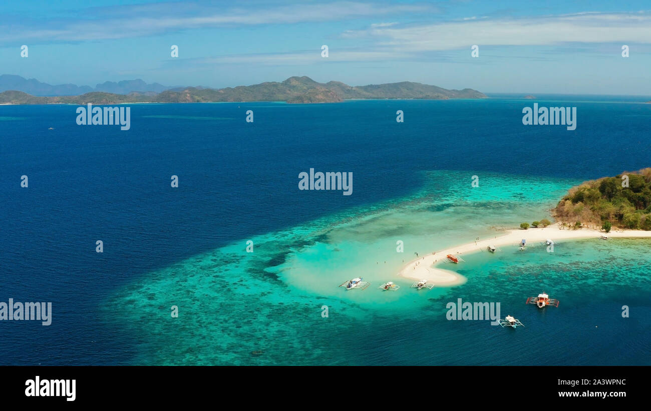 aerial seascape tropical island with sand bar, turquoise water and ...