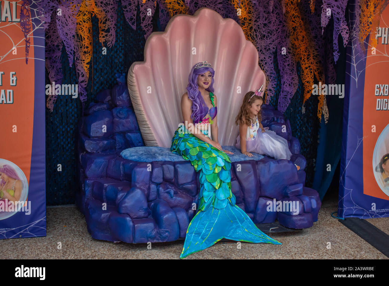 Orlando, Florida. September 21, 2019. Mermaid with little gir at ...