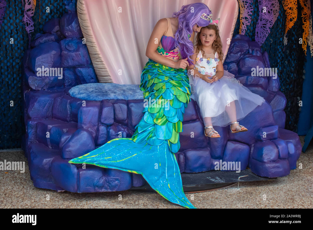 Orlando, Florida. September 21, 2019. Mermaid with little gir at ...