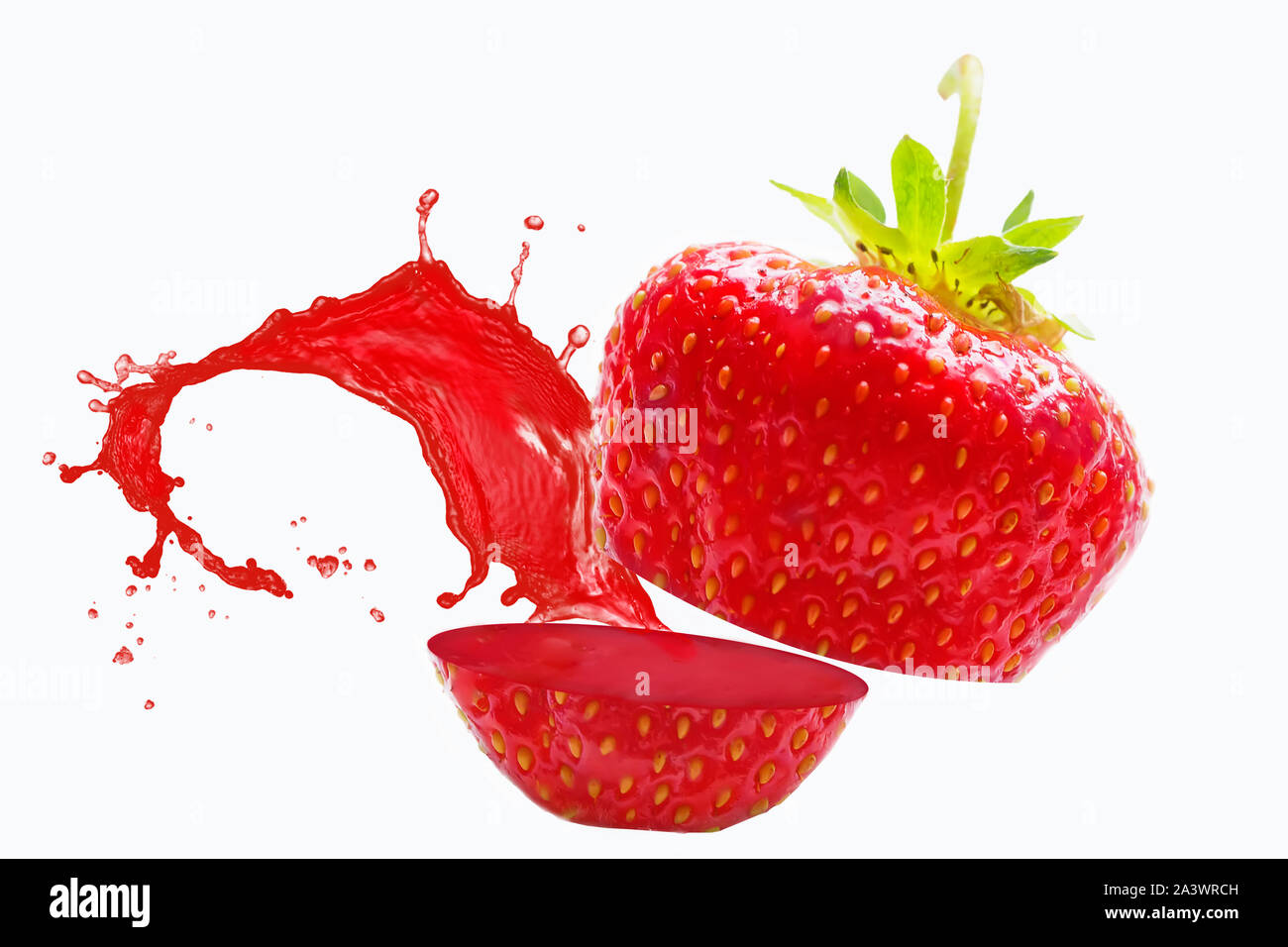 Strawberry sliced with splashing juice on a white background Stock ...