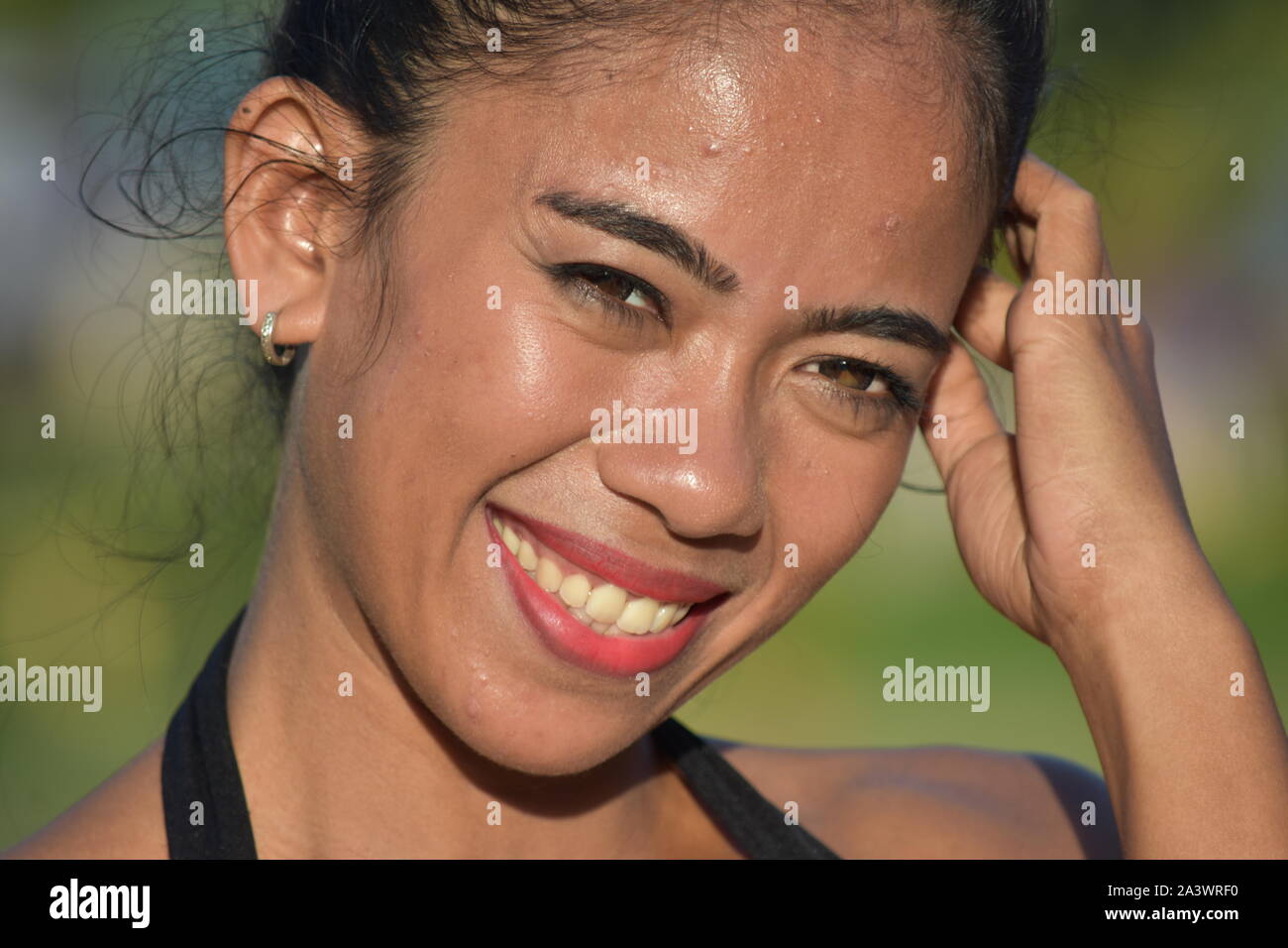 An Asian Female Smiling Stock Photo - Alamy