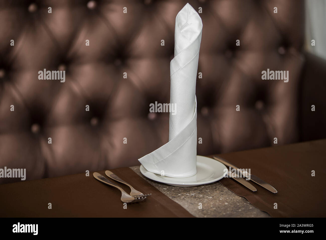 Plate with napkin and cutlery.Restaurant table Stock Photo - Alamy