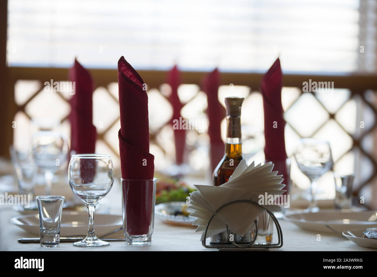 Table in the restaurant with appliances ready for the beginning of ...