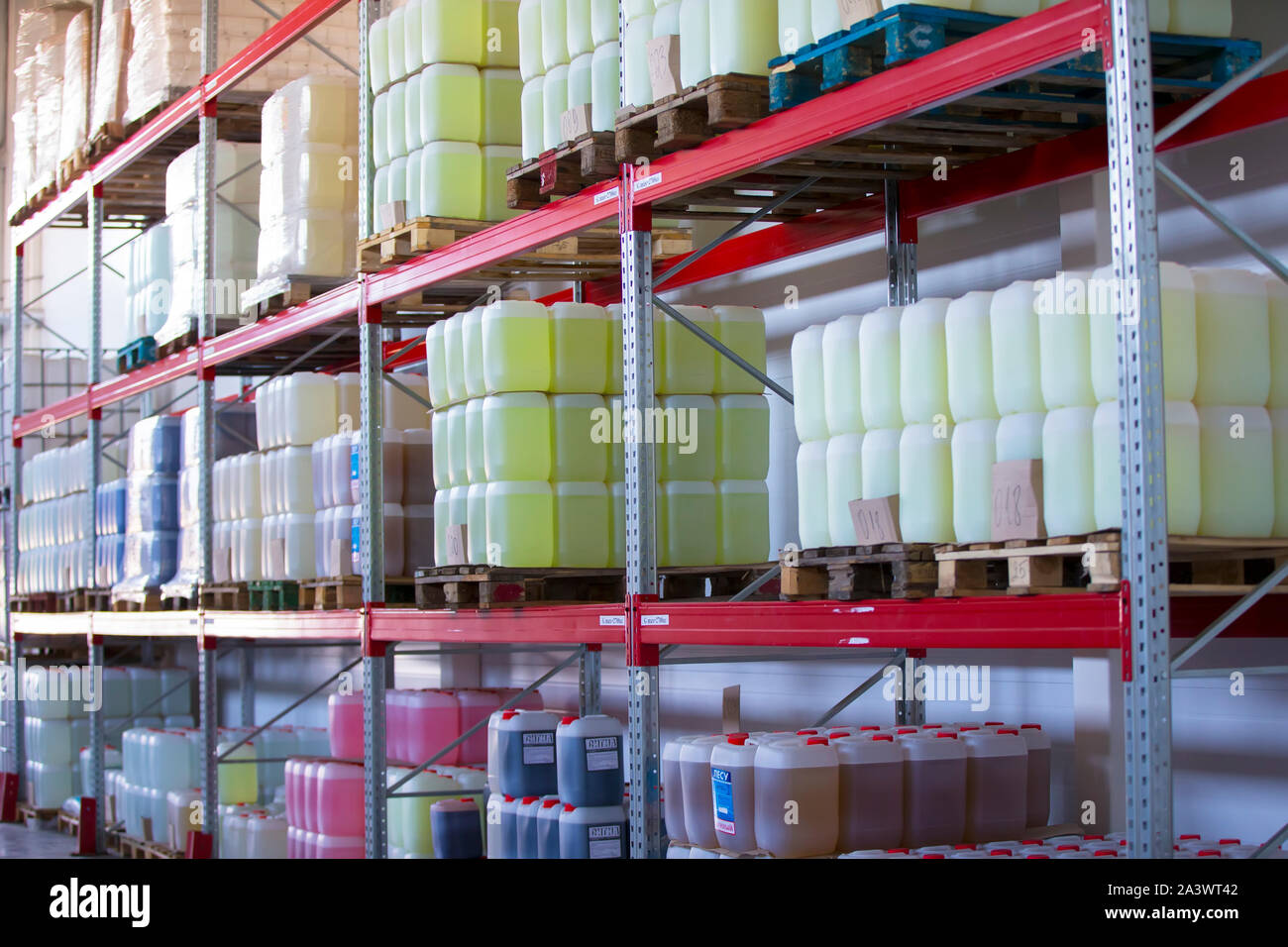 Chemical production.Warehouse with shelves, plastic cans.Warehouse with ...