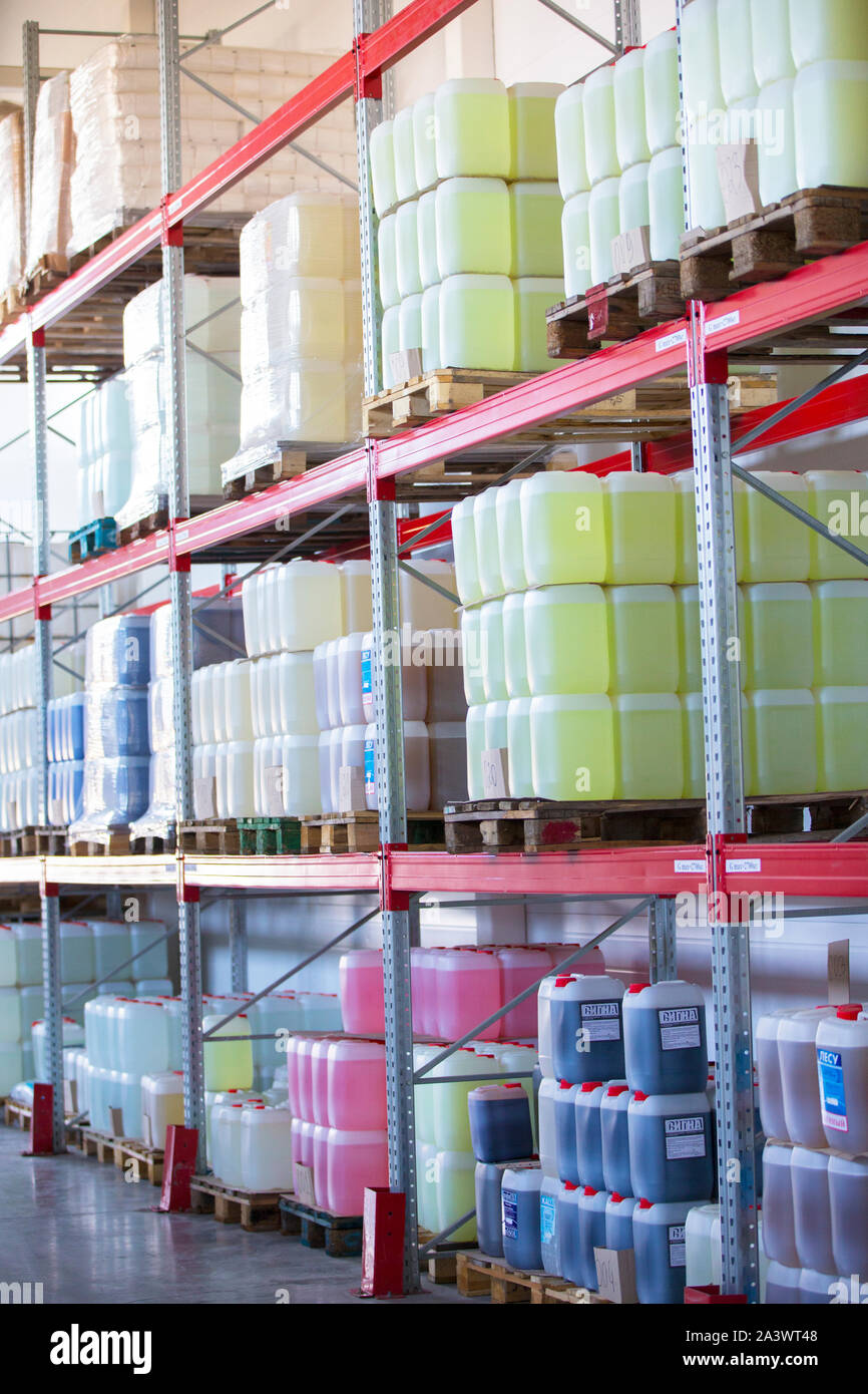 Chemical production.Warehouse with shelves, plastic cans.Warehouse with ...