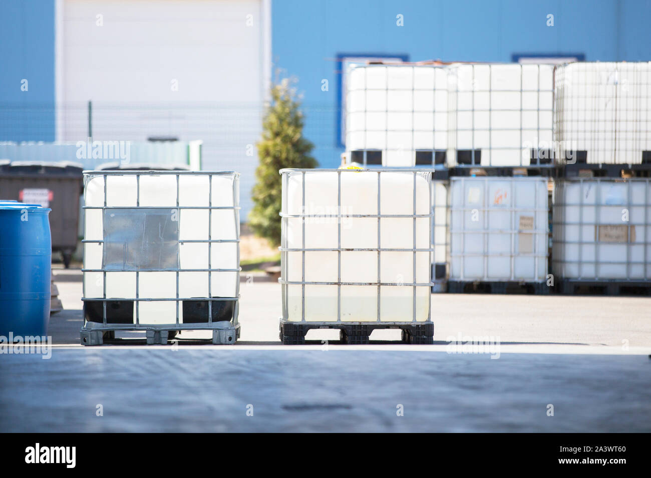 Large plastic containers in the factory Stock Photo - Alamy