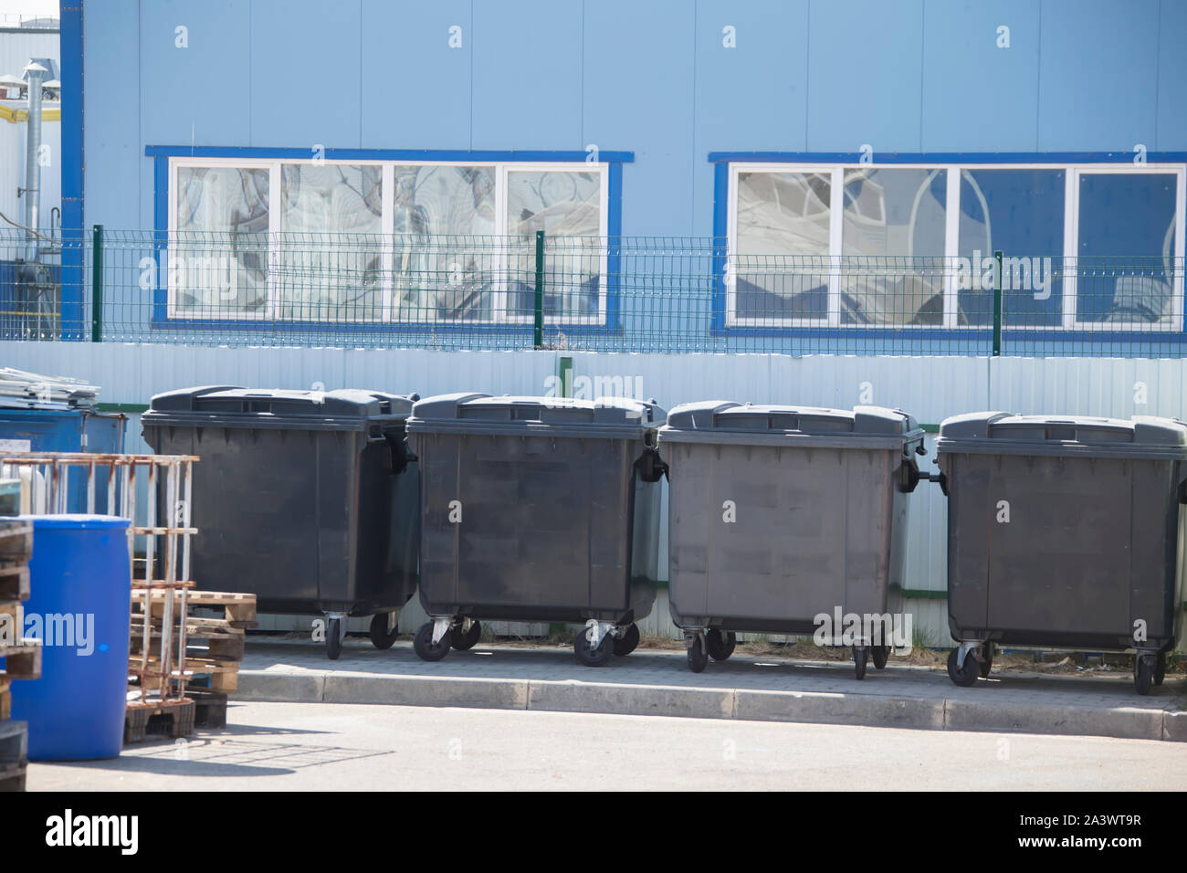trash bins on the territory of large-scale production Stock Photo - Alamy