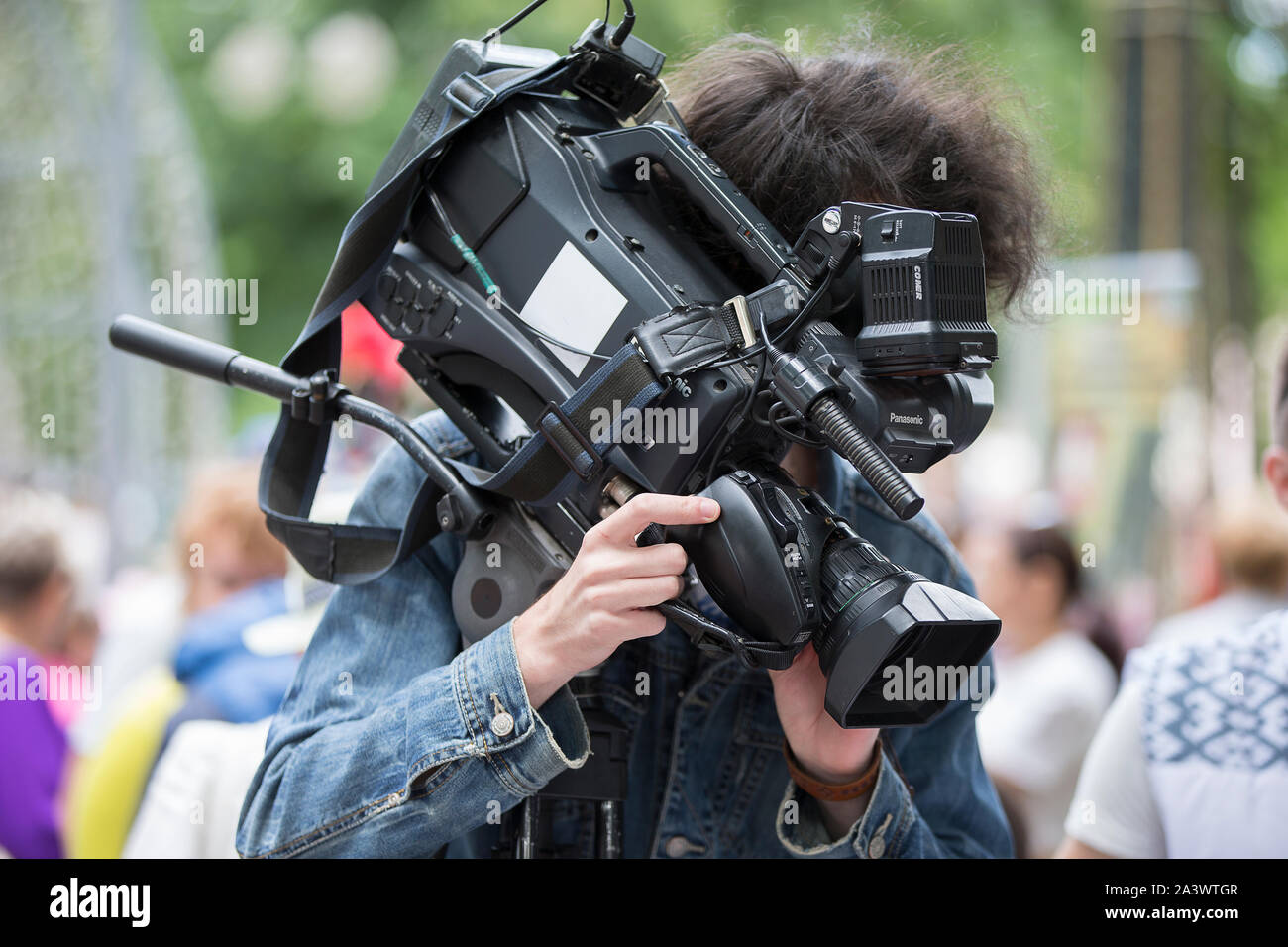 Youth Festival.Cameraman with a big video camera.Video shooting on the ...