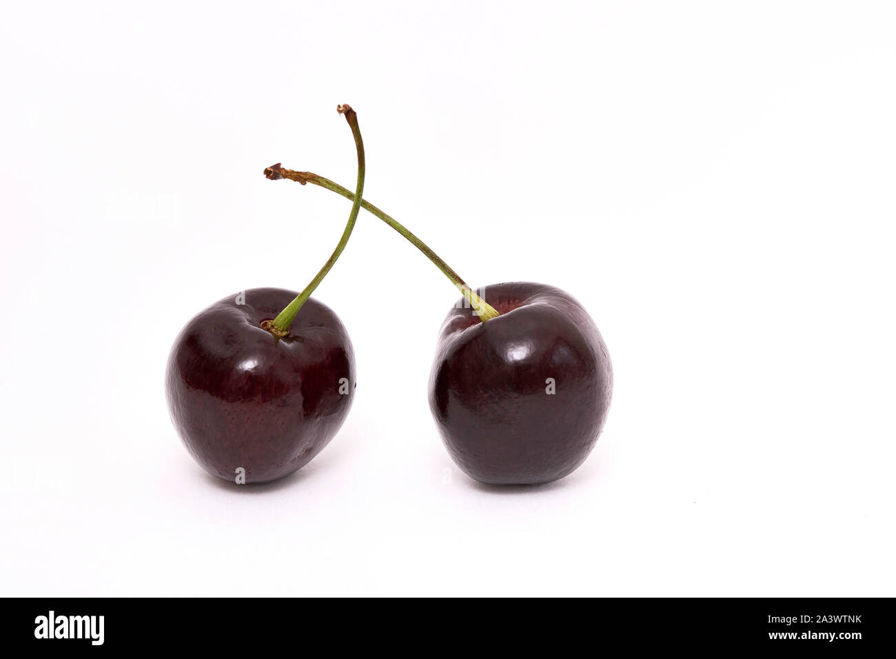 Close up two red cherries hi-res stock photography and images - Alamy