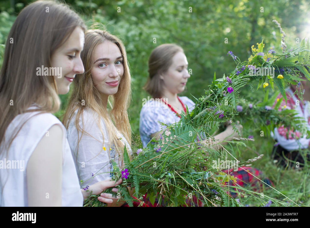 Belarus, the city of Gomel, July 07, 2018. Holiday Kupala. Girls weave ...