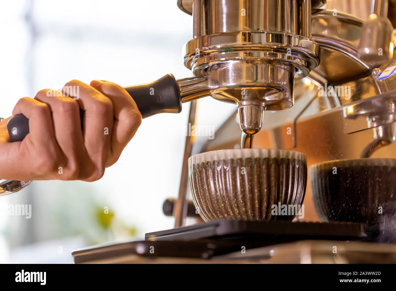 Step by step coffee making part five. Carefully insert the group handle ...