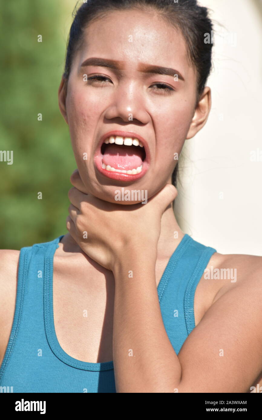 Beautiful Filipina Female Choking Stock Photo - Alamy