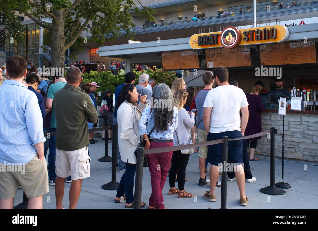 People Standing In Line At Restaurant