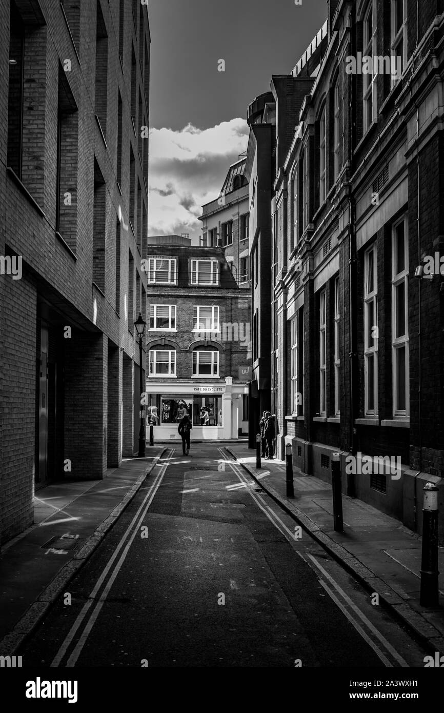 Streets in London near the Liverpool street in black and white. Dark ...
