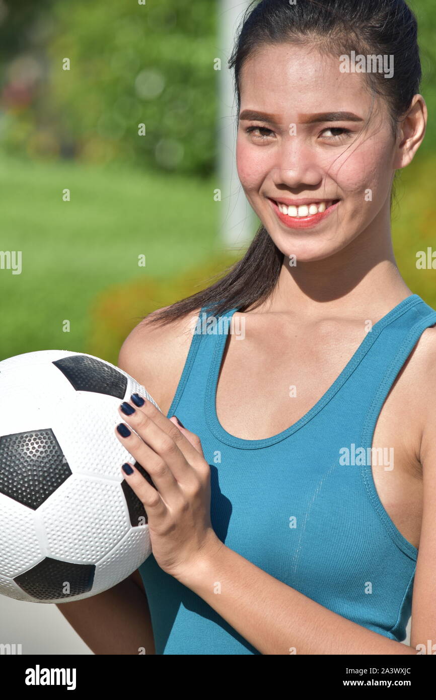 Sporty Female Athlete Smiling With Soccer Ball Stock Photo - Alamy