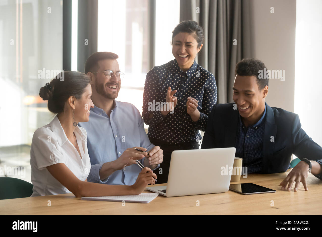 Happy diverse office workers team laugh work together at meeting Stock ...