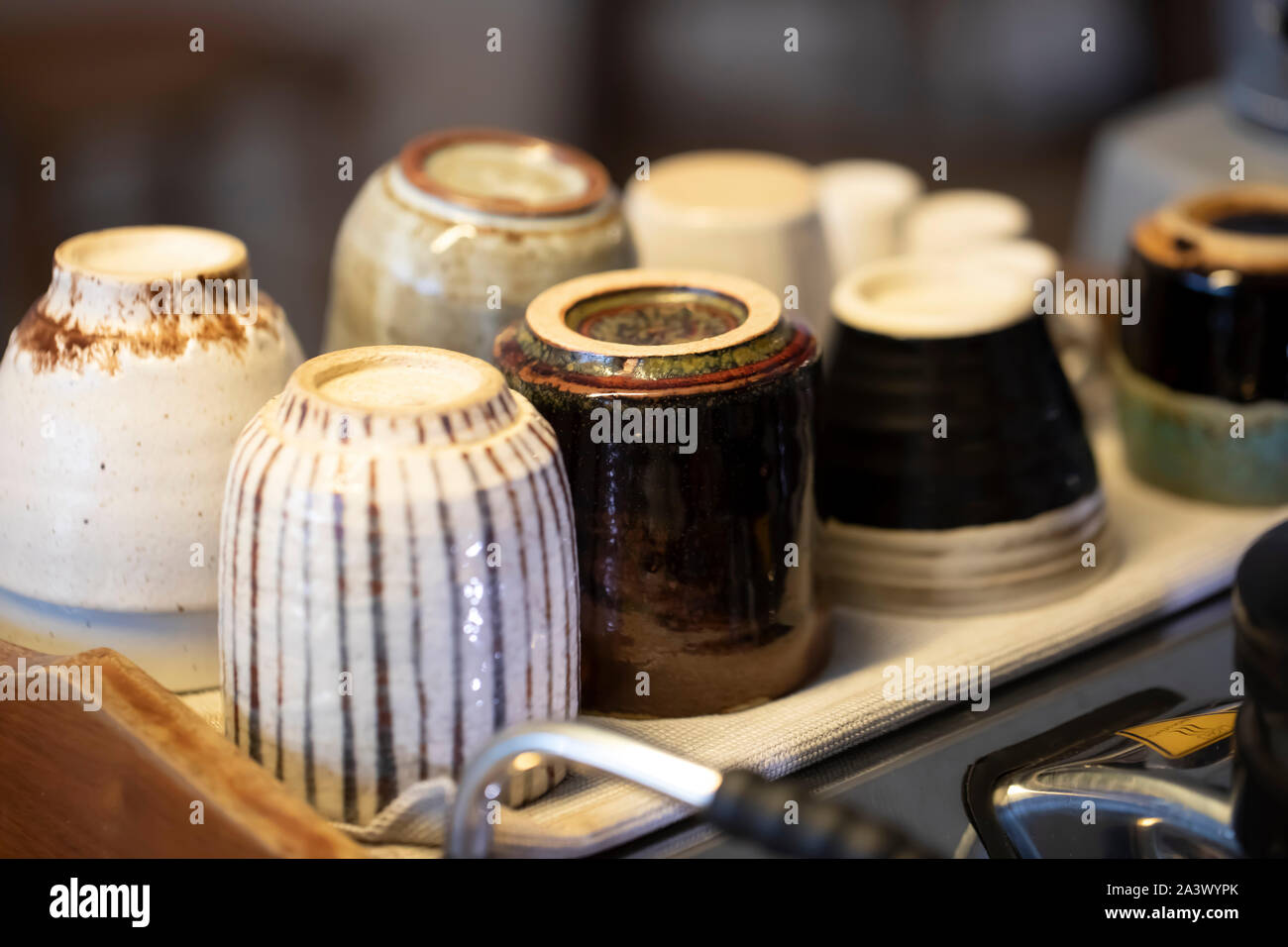 Step by step coffee making part nine. Cups are stored and heated above ...