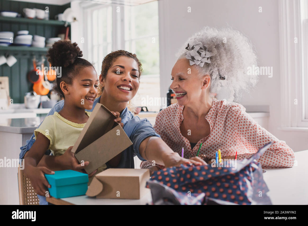 Three generations of family celebrating a birthday together Stock Photo ...