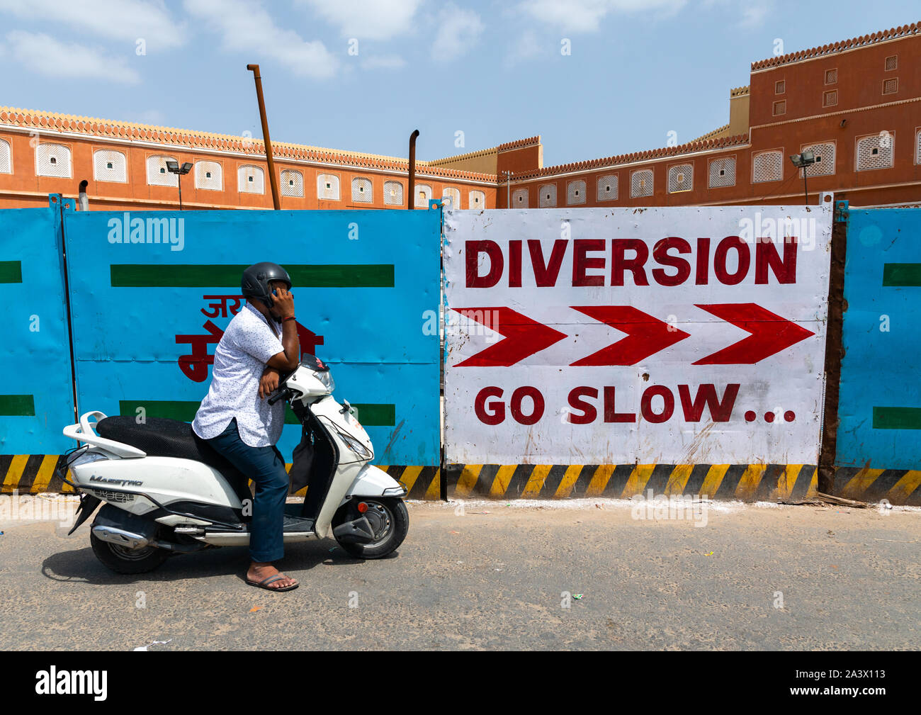 Indian man calling with his mobile phone on his scooter, Rajasthan ...