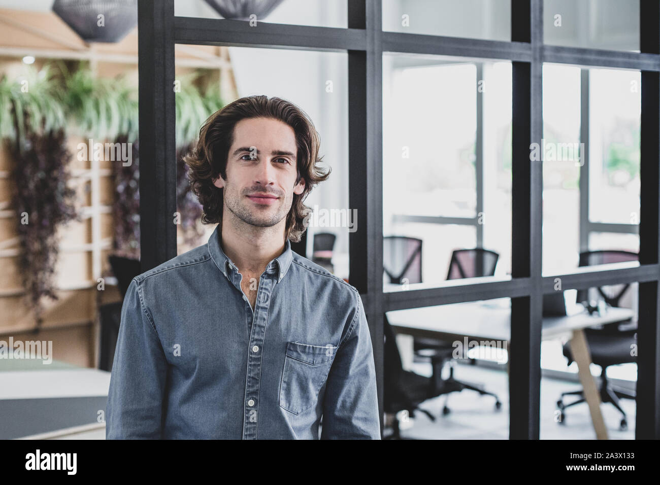 Portrait of a male freelancer in a coworking space Stock Photo - Alamy