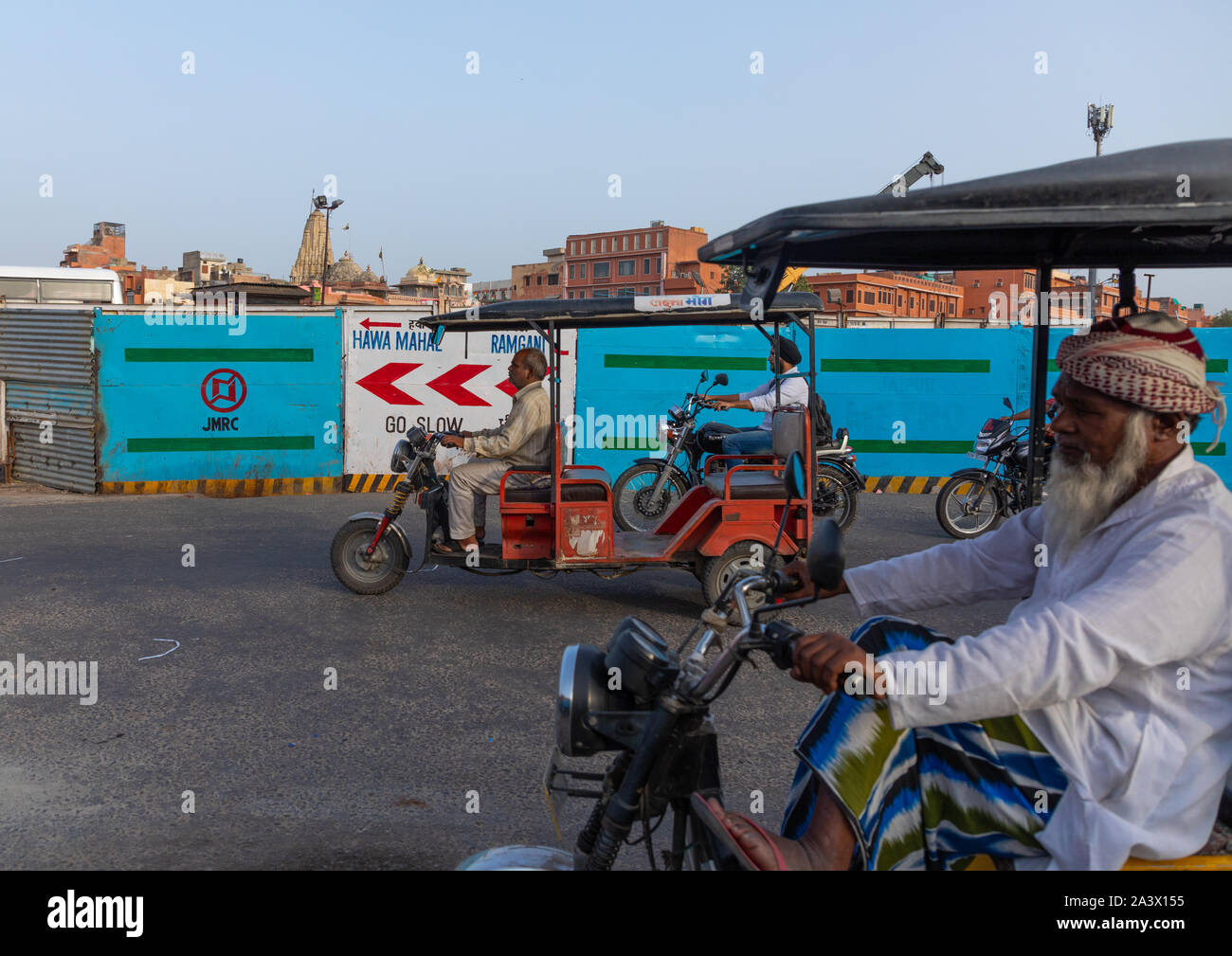 Indian men riding rickshaws in the street, Rajasthan, Jaipur, India ...