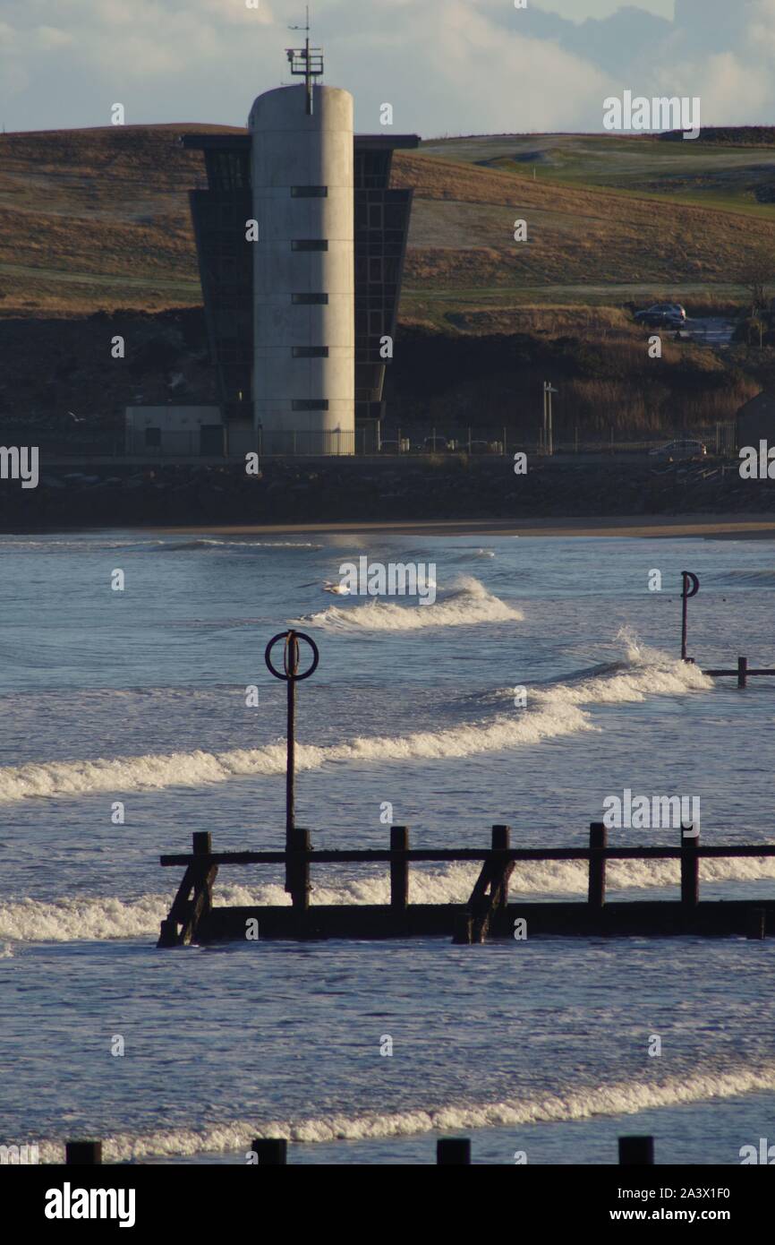 Aberdeen Harbour Control Tower, beyond the Beach with Wooden Groynes ...