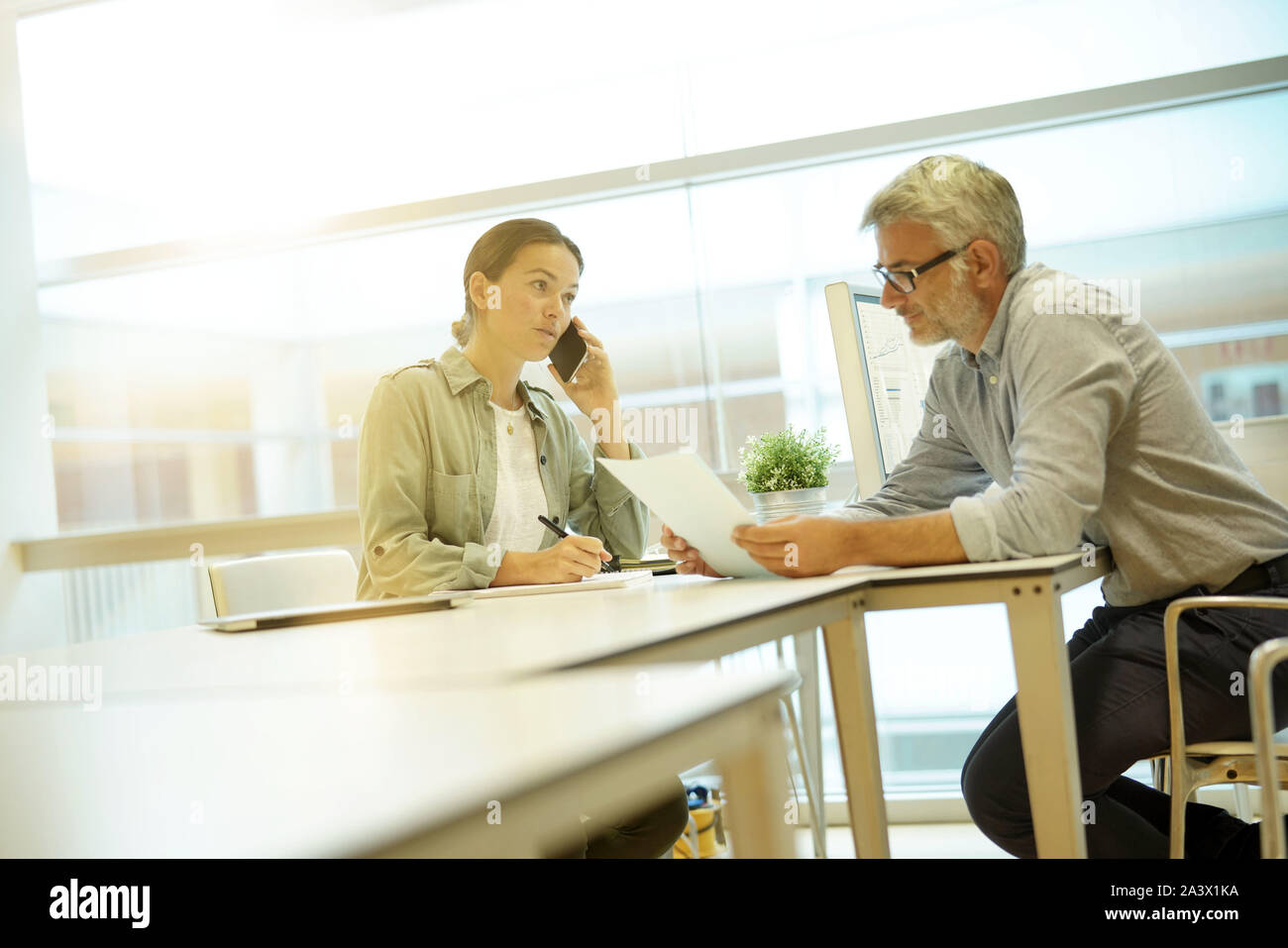Informal business meeting between work colleagues Stock Photo - Alamy