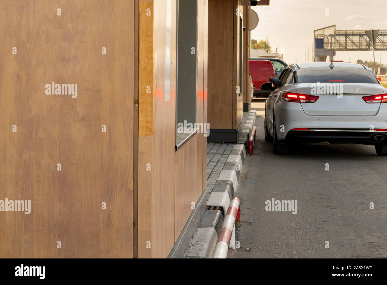 Car near the window of a fast food restaurant. Payment and receipt of ...