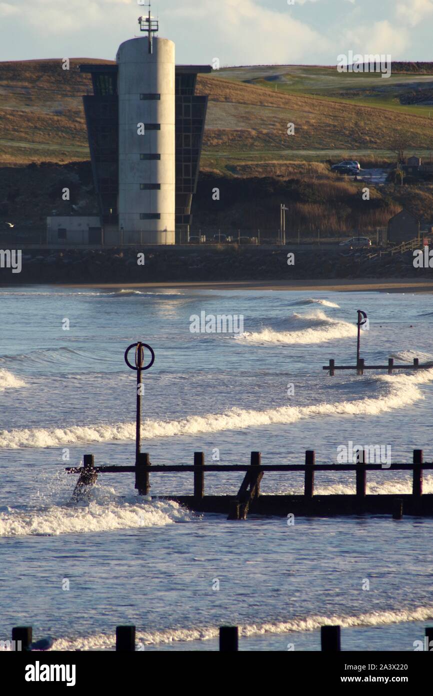 Aberdeen Harbour Control Tower, beyond the Beach with Wooden Groynes ...