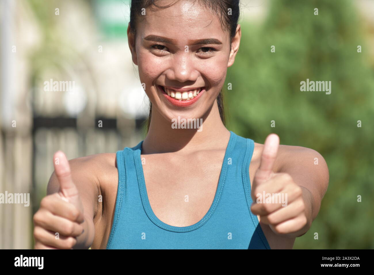 Thumbs up young asian woman hi-res stock photography and images - Alamy