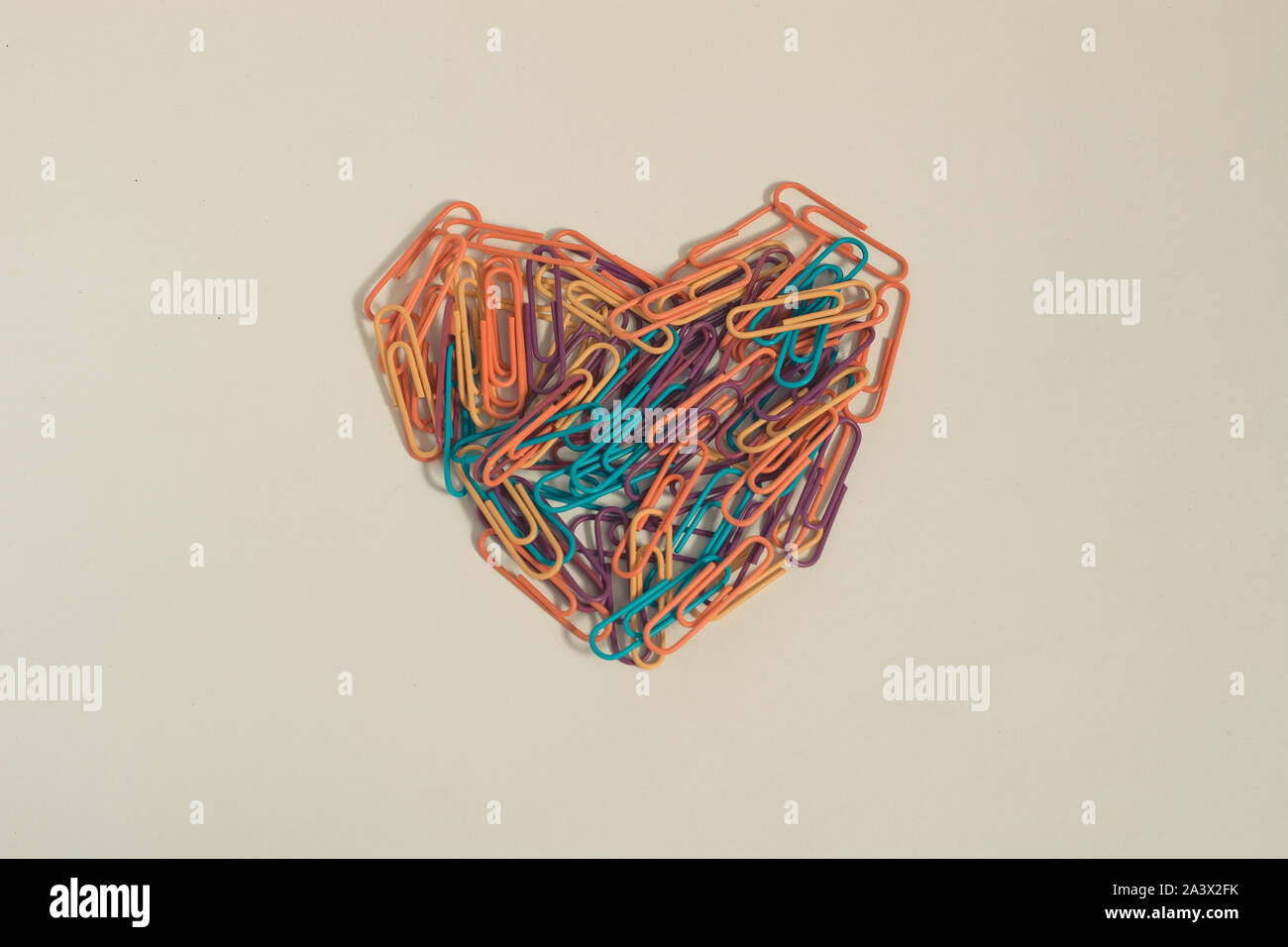 heart made of clips, love concept and office supplies on white isolated ...