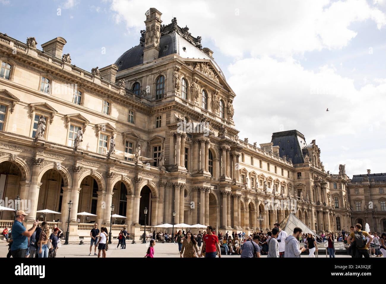 The Louvre Museum facing the Napoleon courtyard and the glass pyramid ...