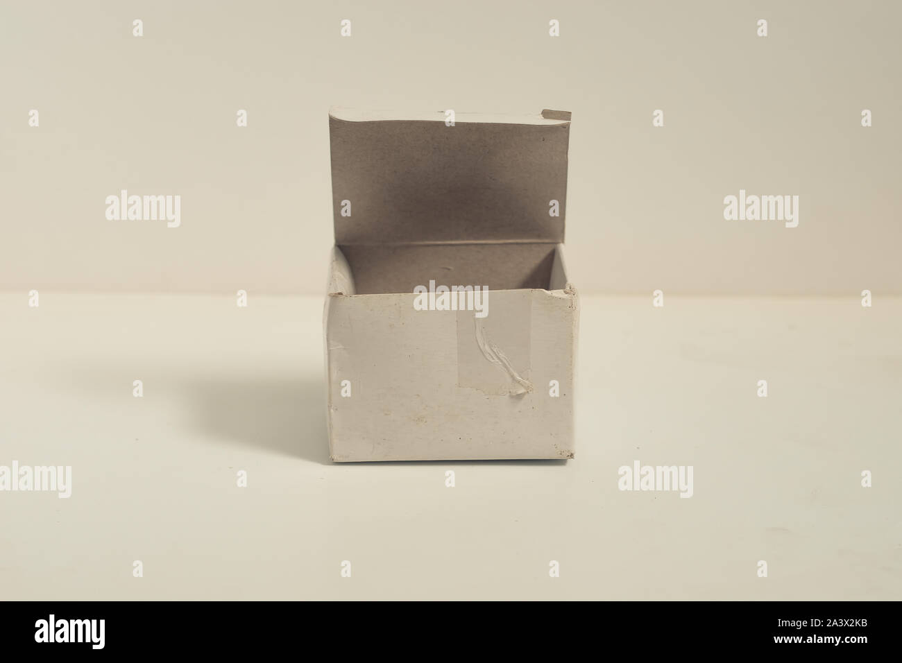 small open square cardboard box on isolated white background, designed ...