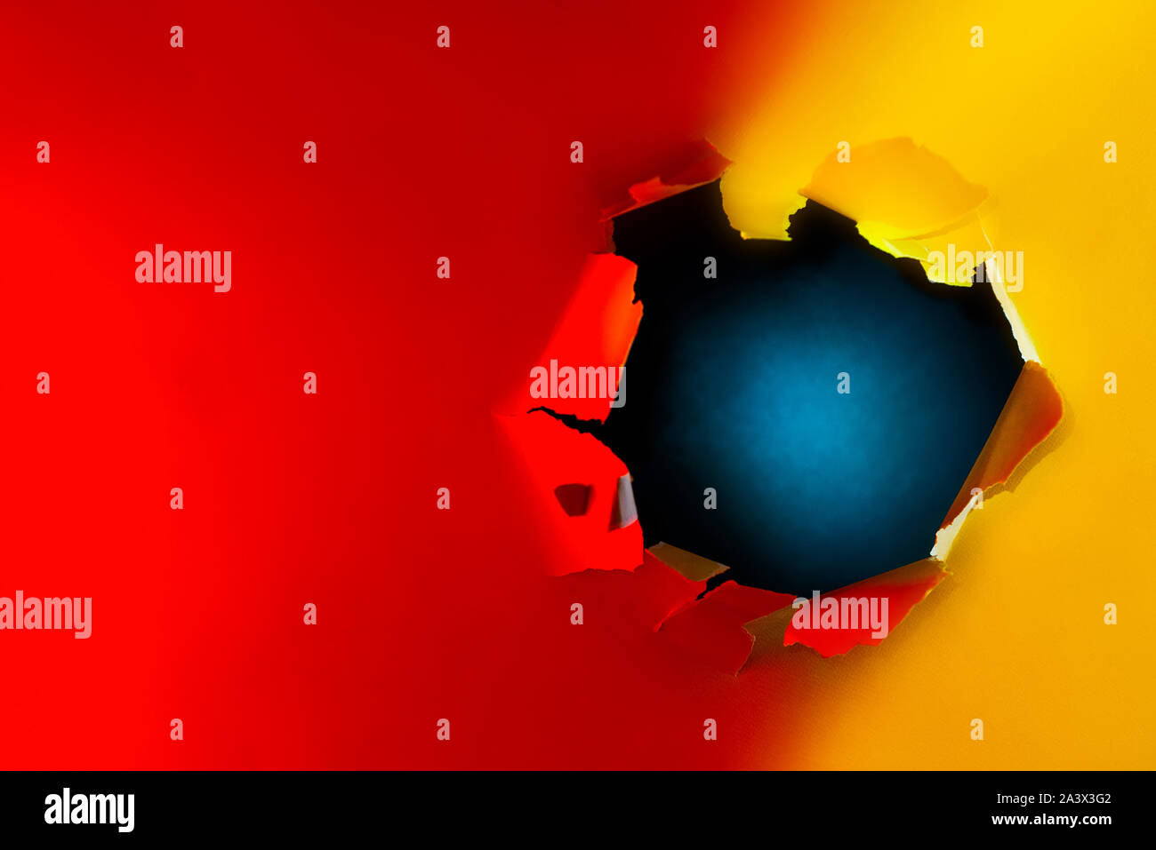 A ragged hole in a bright paper background lit by neon Stock Photo - Alamy