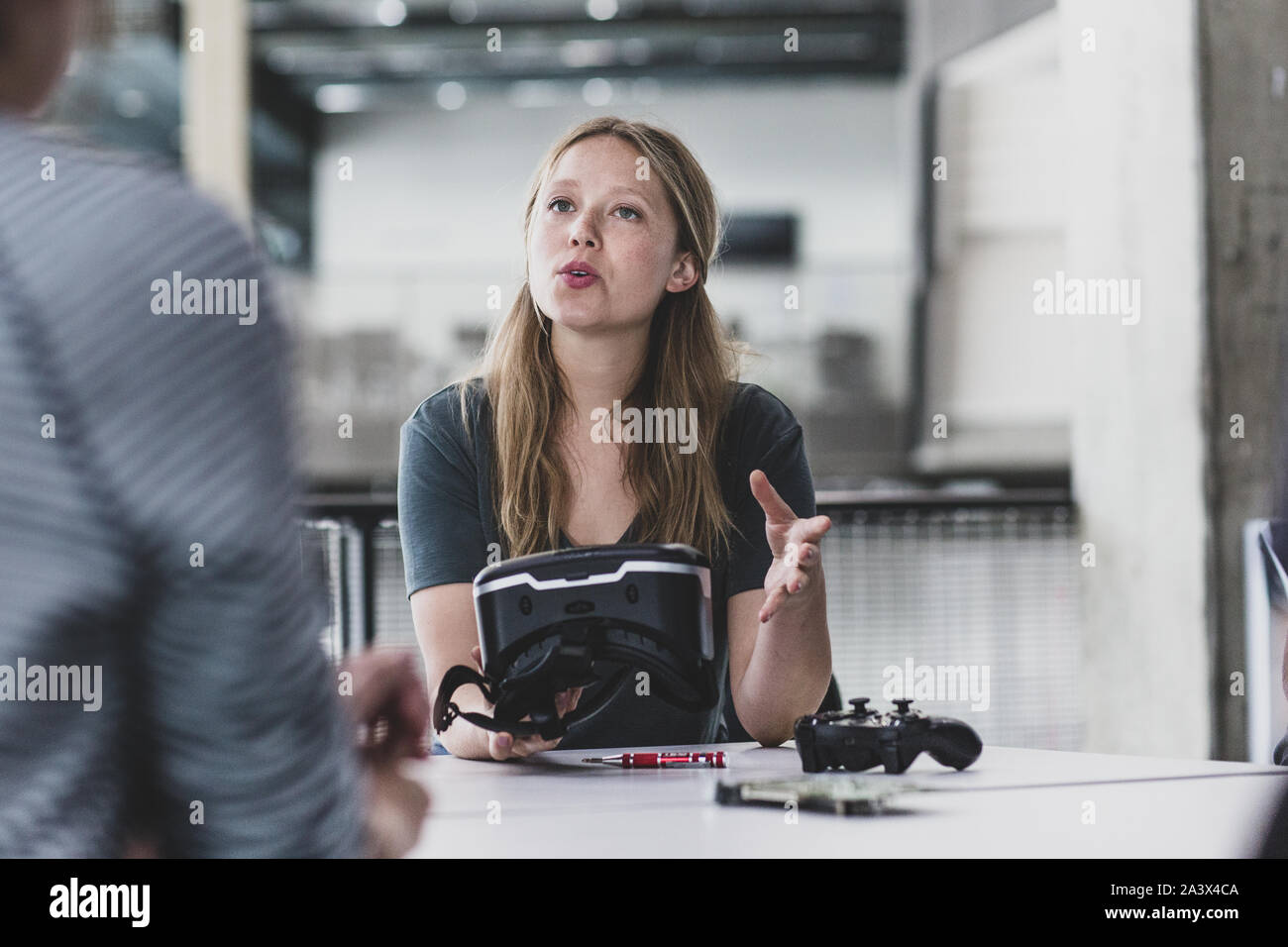 Female game designer leading a meeting hi-res stock photography and ...