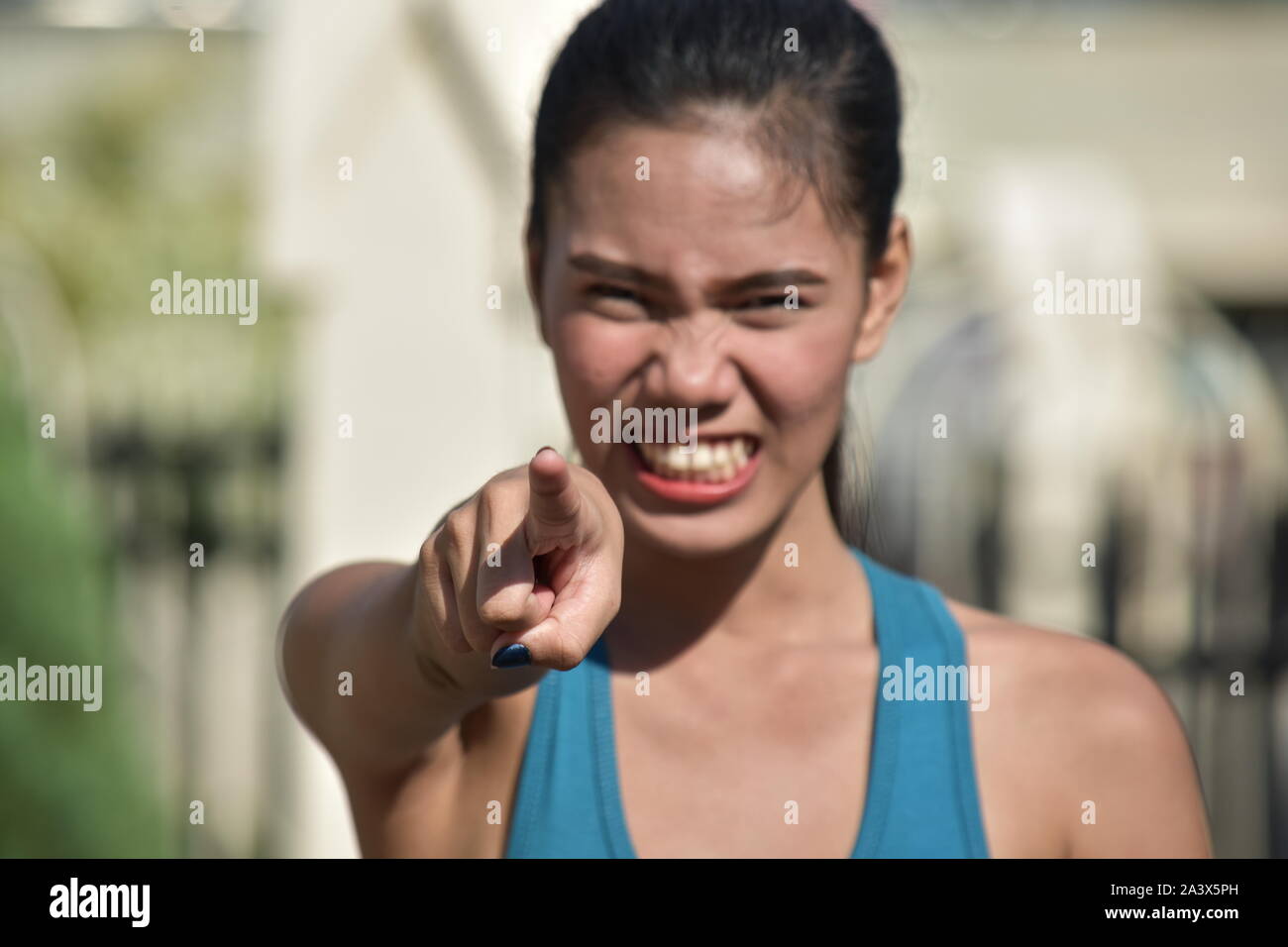 An Attractive Filipina Female Pointing Stock Photo - Alamy