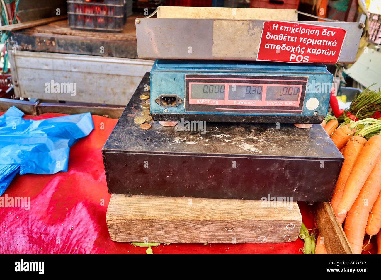 Weighing scales at a market in Crete, Greece Stock Photo - Alamy