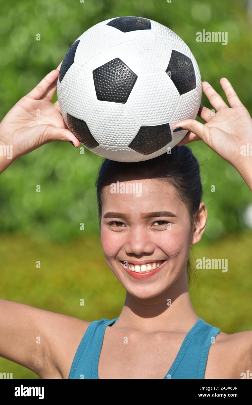 Girl Smiling With Soccer Ball Stock Photo - Alamy