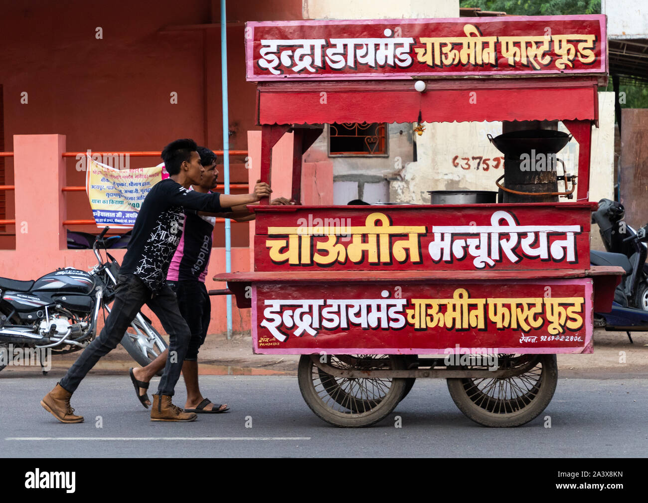 Indian men pushing a food stall, Rajasthan, Bikaner, India Stock Photo ...