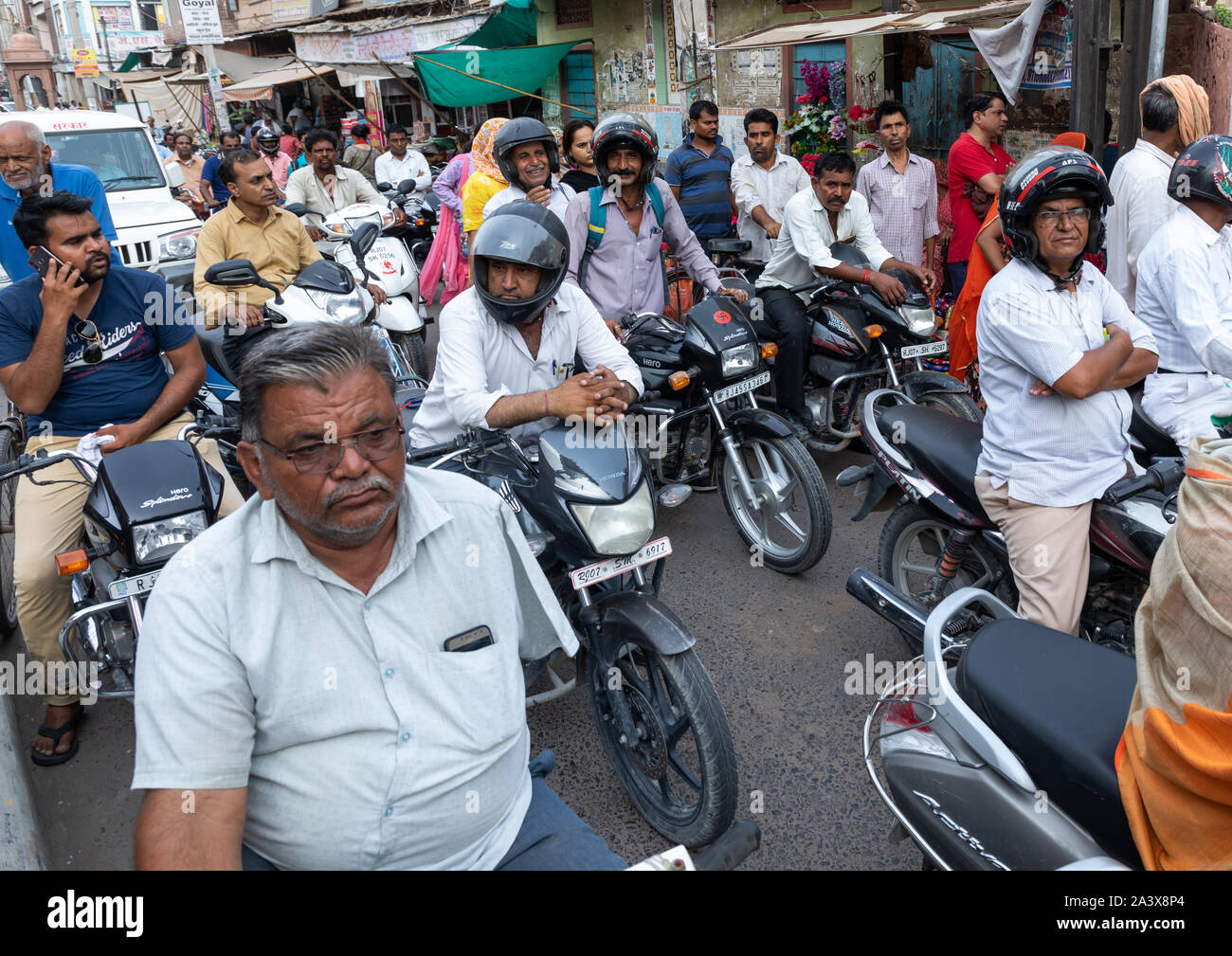 Indian riders ride motorbikes on busy road, Rajasthan, Bikaner, India ...