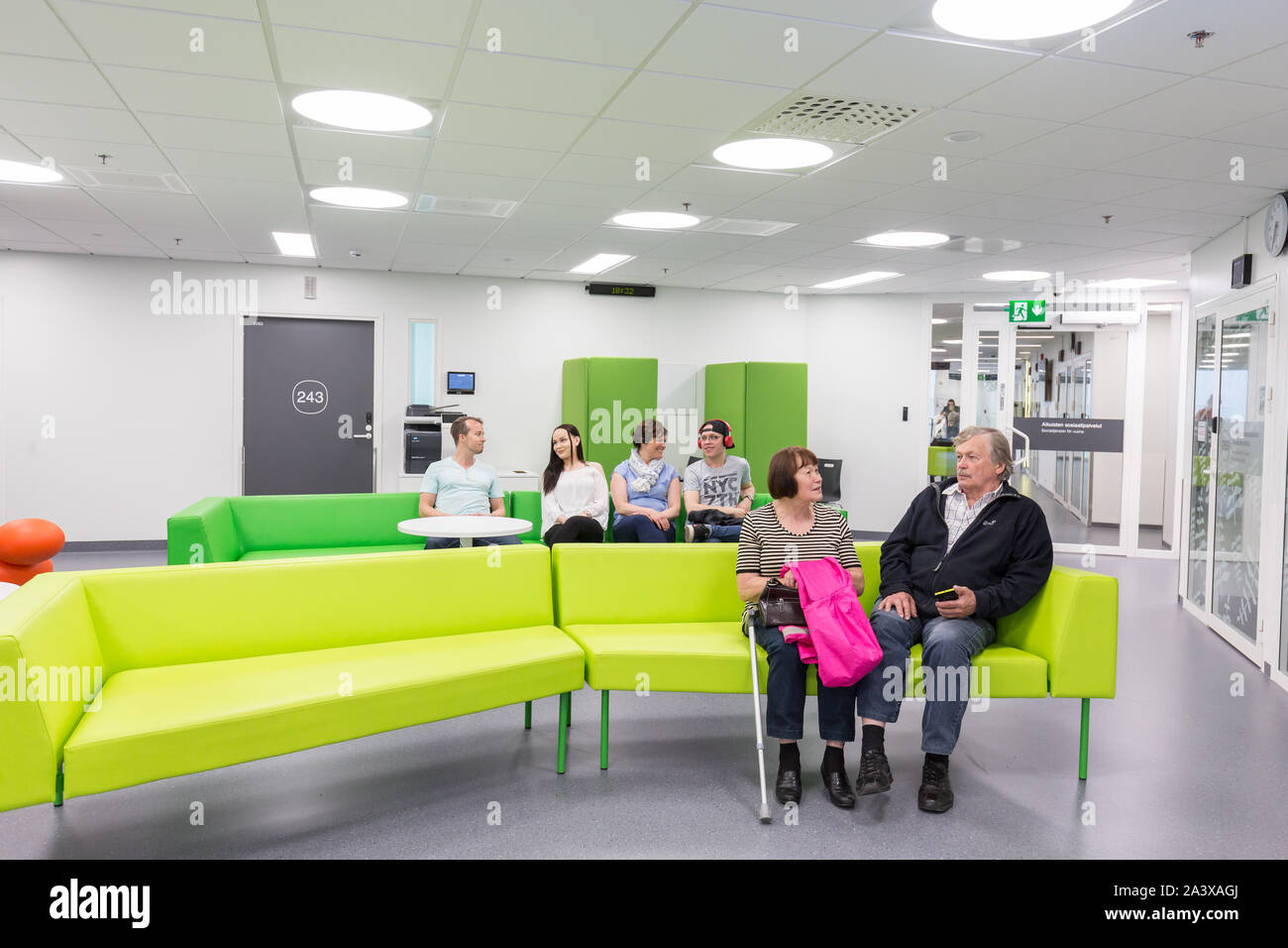 Group of people waiting their turn in a hospital lobby Stock Photo - Alamy