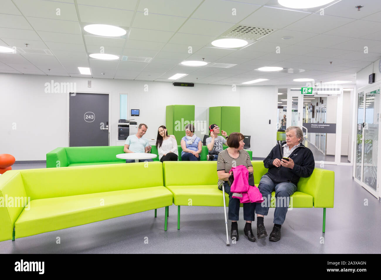 Group of people waiting their turn in a hospital lobby Stock Photo - Alamy