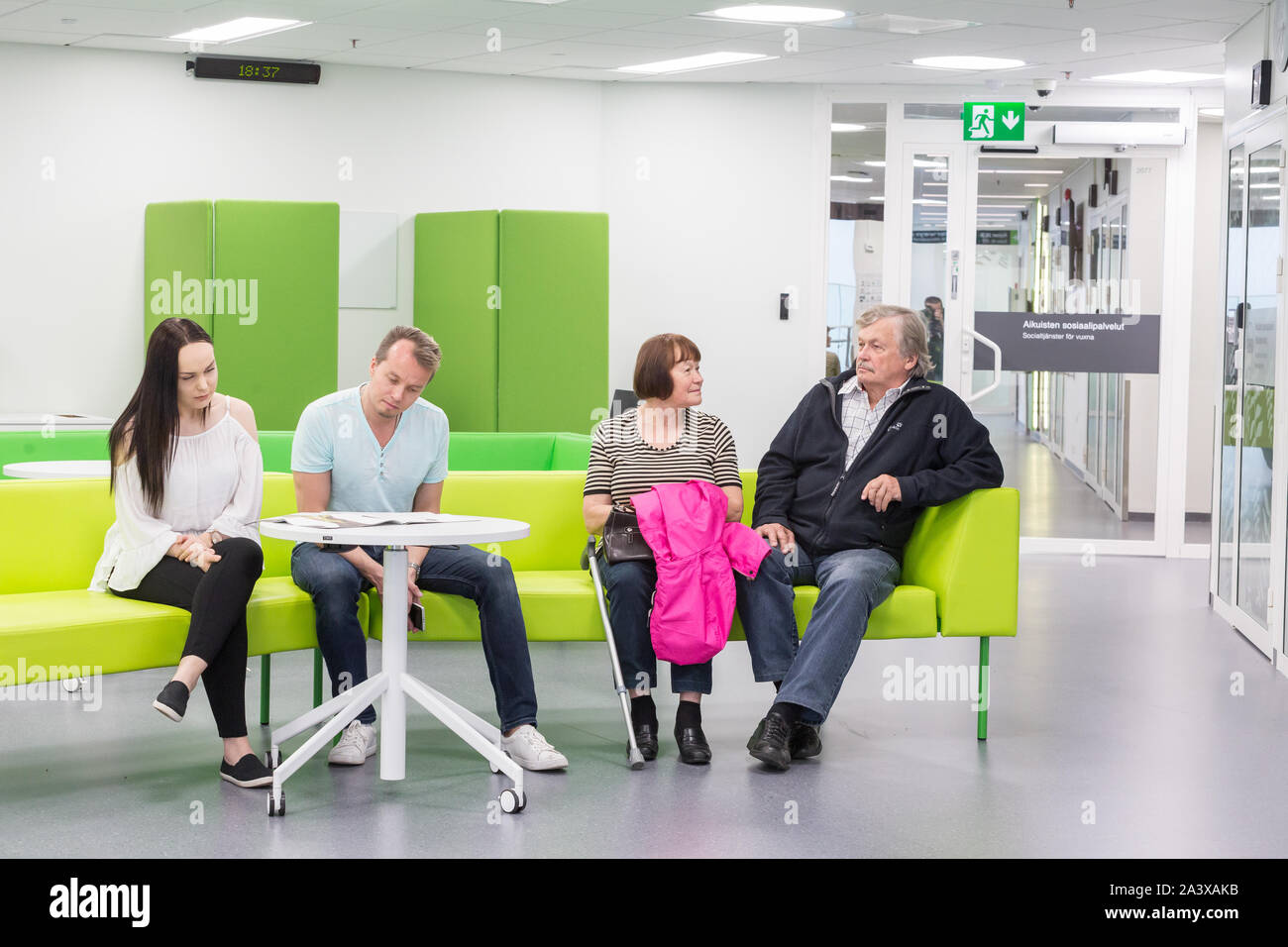 Group of people waiting their turn in a hospital lobby Stock Photo - Alamy