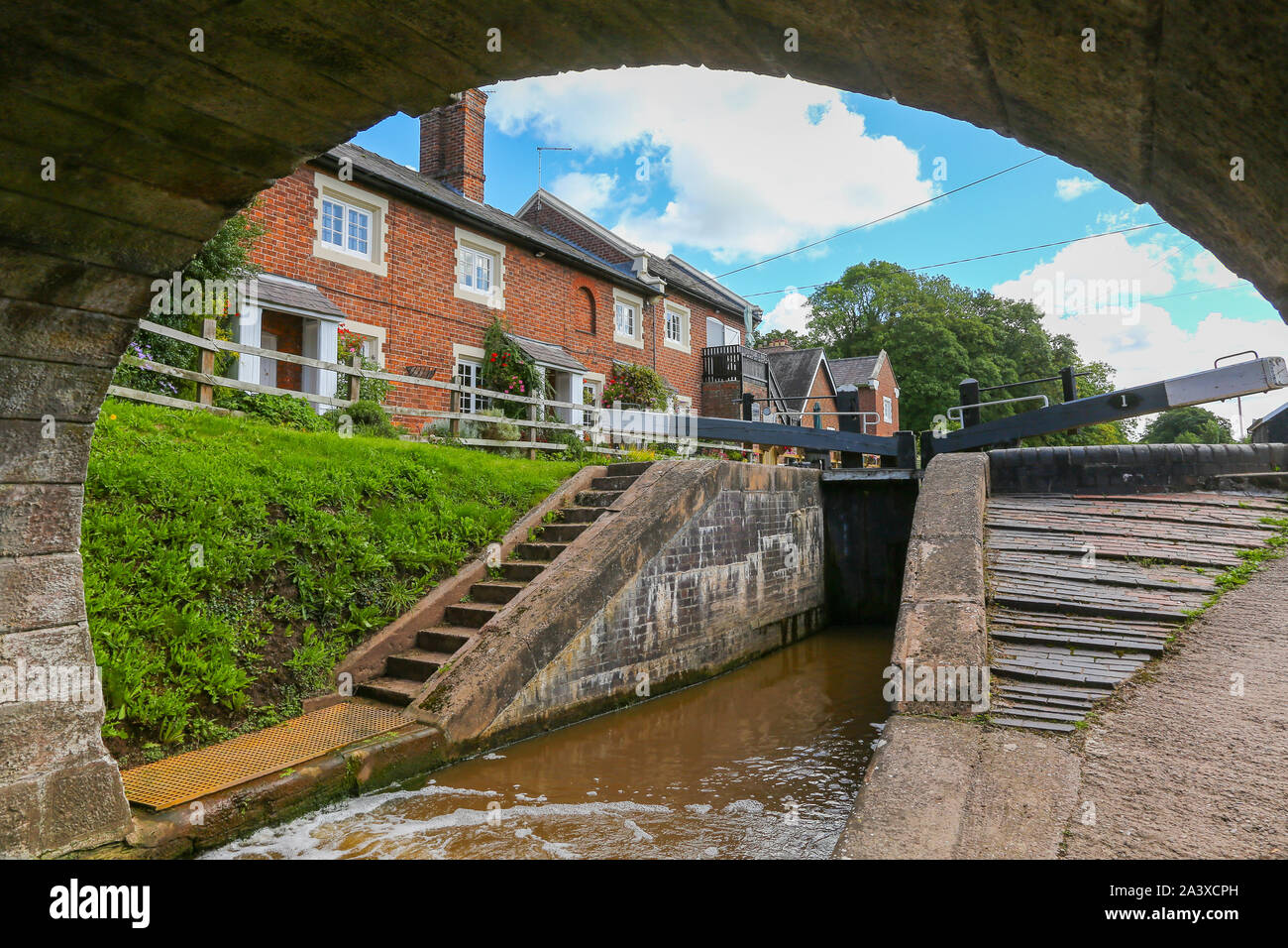 Looking under the bridge at Tyrley Wharf and locks, Tyrley, on the ...