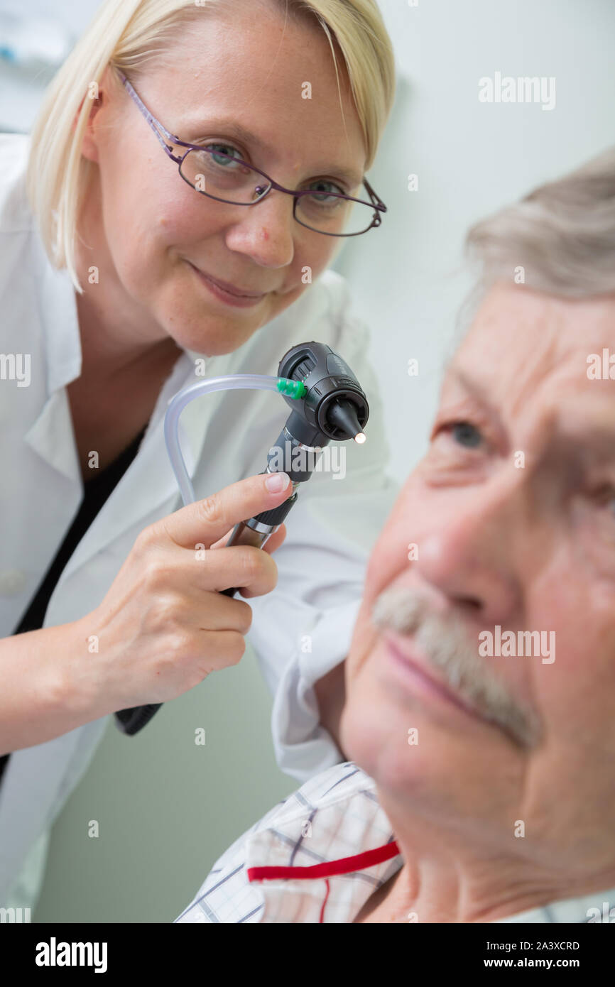 Elderly patient at doctors appointment at ear examination Stock Photo ...