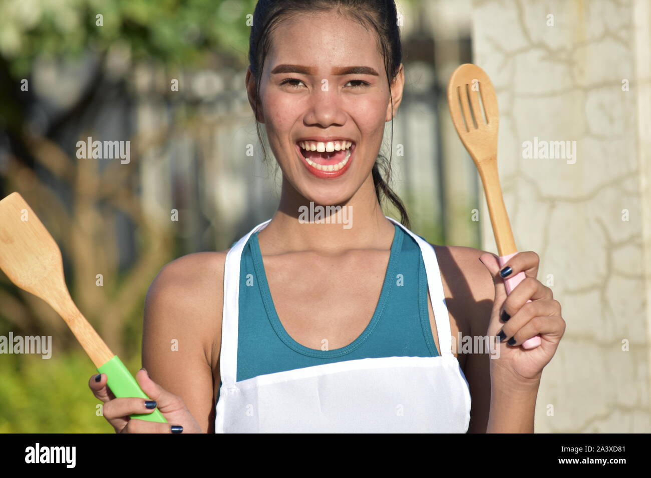 Young Chef And Laughter Wearing Apron Stock Photo - Alamy