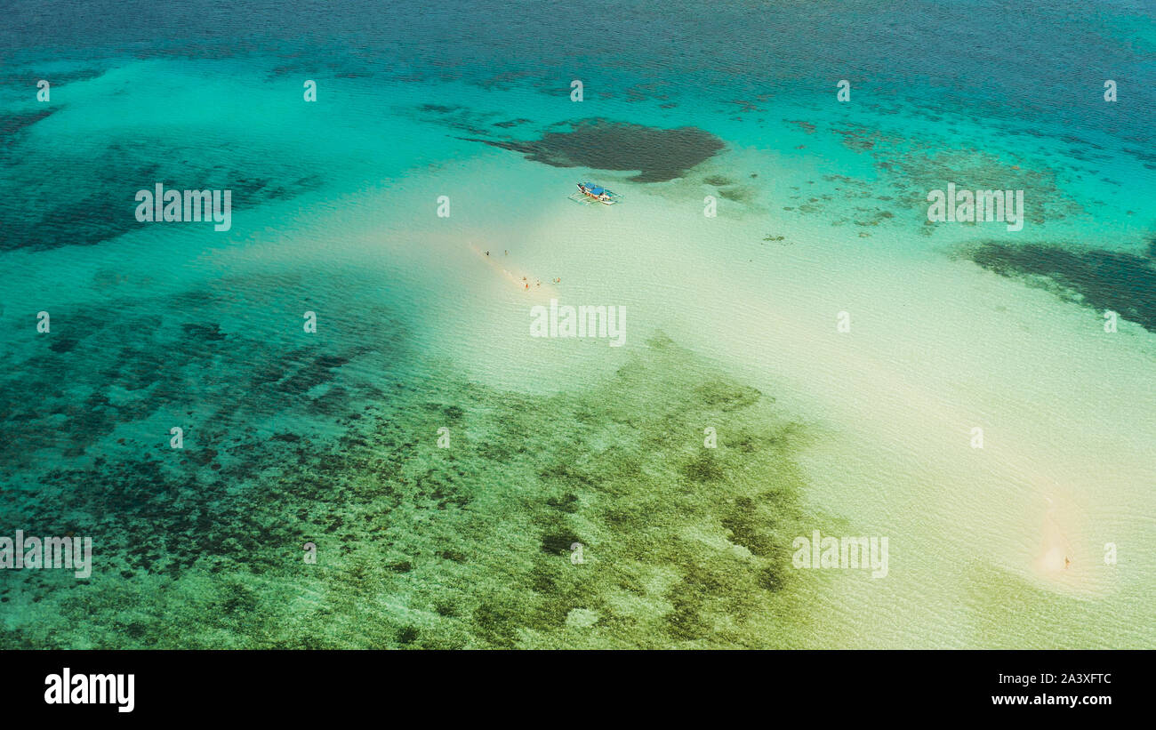 Sand bar among coral reefs in turquoise atoll water, top view. Summer ...
