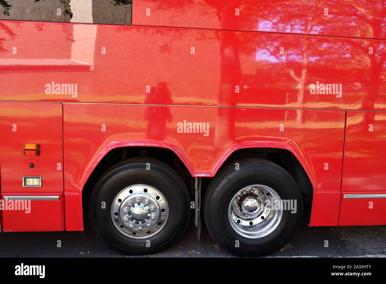 Big Red Tourist Bus Parked by Museum While Riders Tour the Museum and ...