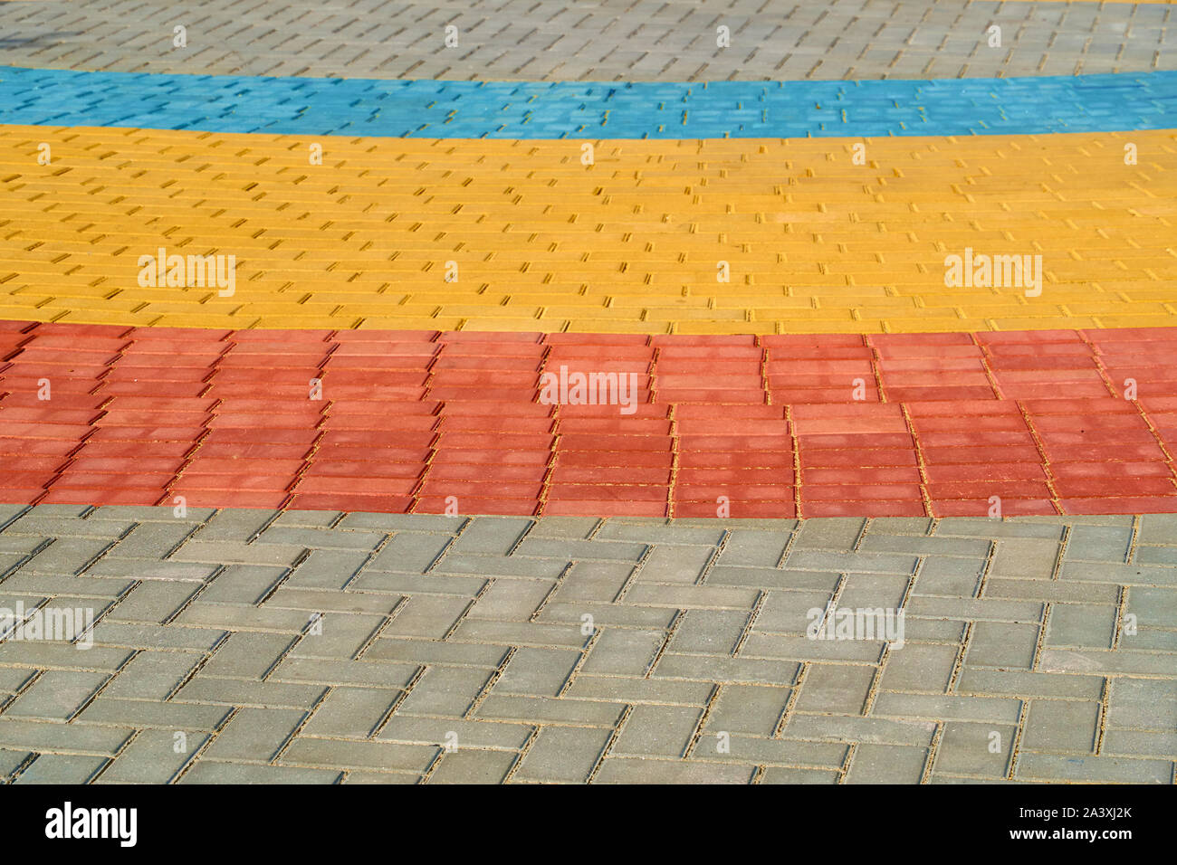 yellow, red and blue paving tiles for background or texture Stock Photo ...